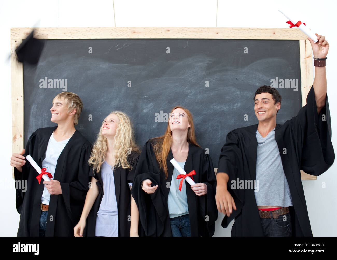 Group of people celebrating after Graduation Stock Photo - Alamy