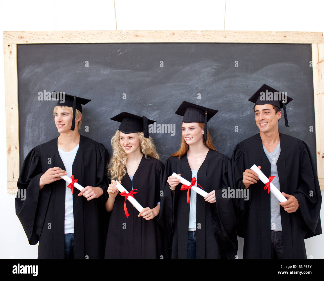 Group of people celebrating after Graduation Stock Photo - Alamy