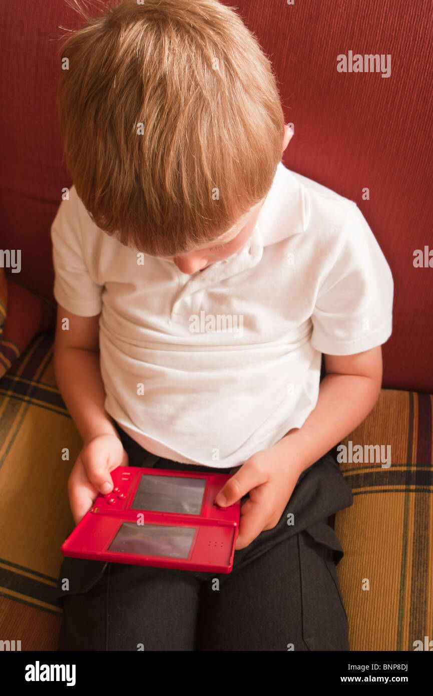 A MODEL RELEASED close up picture of a six year old boy playing on a ...