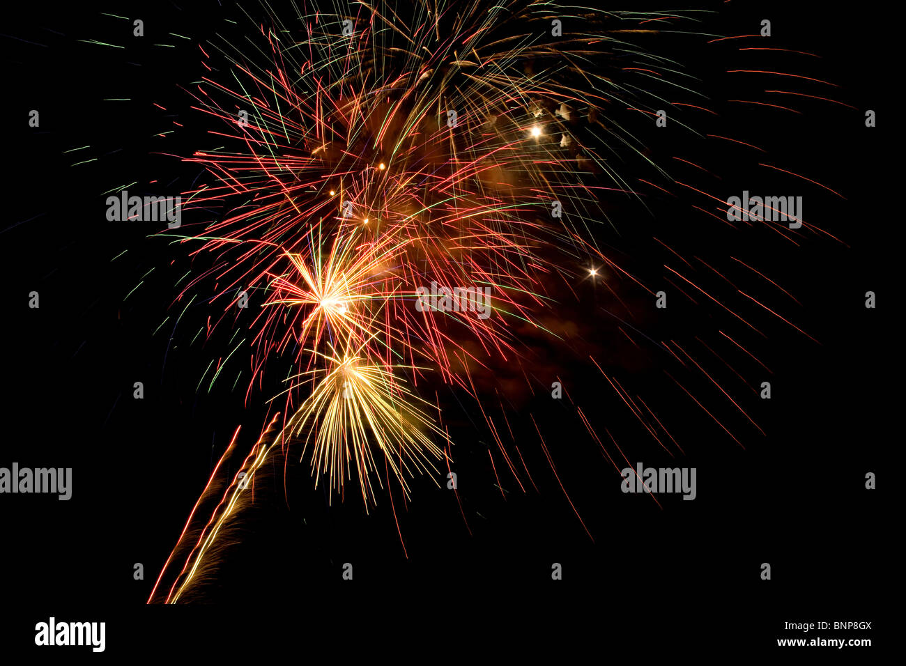 Bright colored fireworks on black background Stock Photo - Alamy
