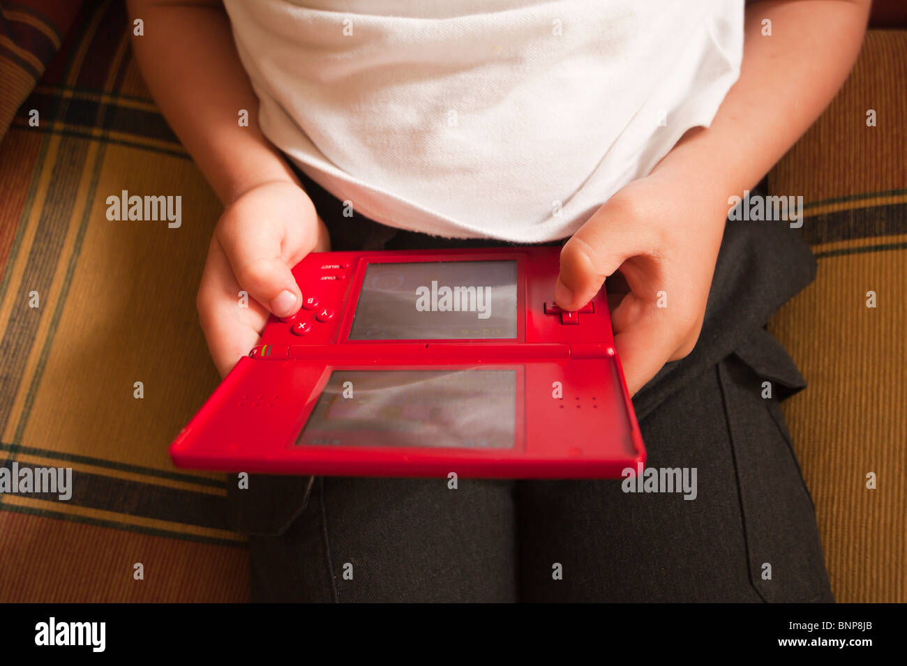 A MODEL RELEASED close up picture of a six year old boy playing on a ...