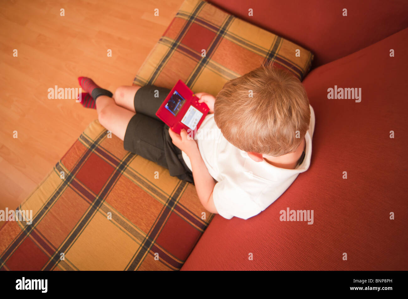 A MODEL RELEASED close up picture of a six year old boy playing on a ...