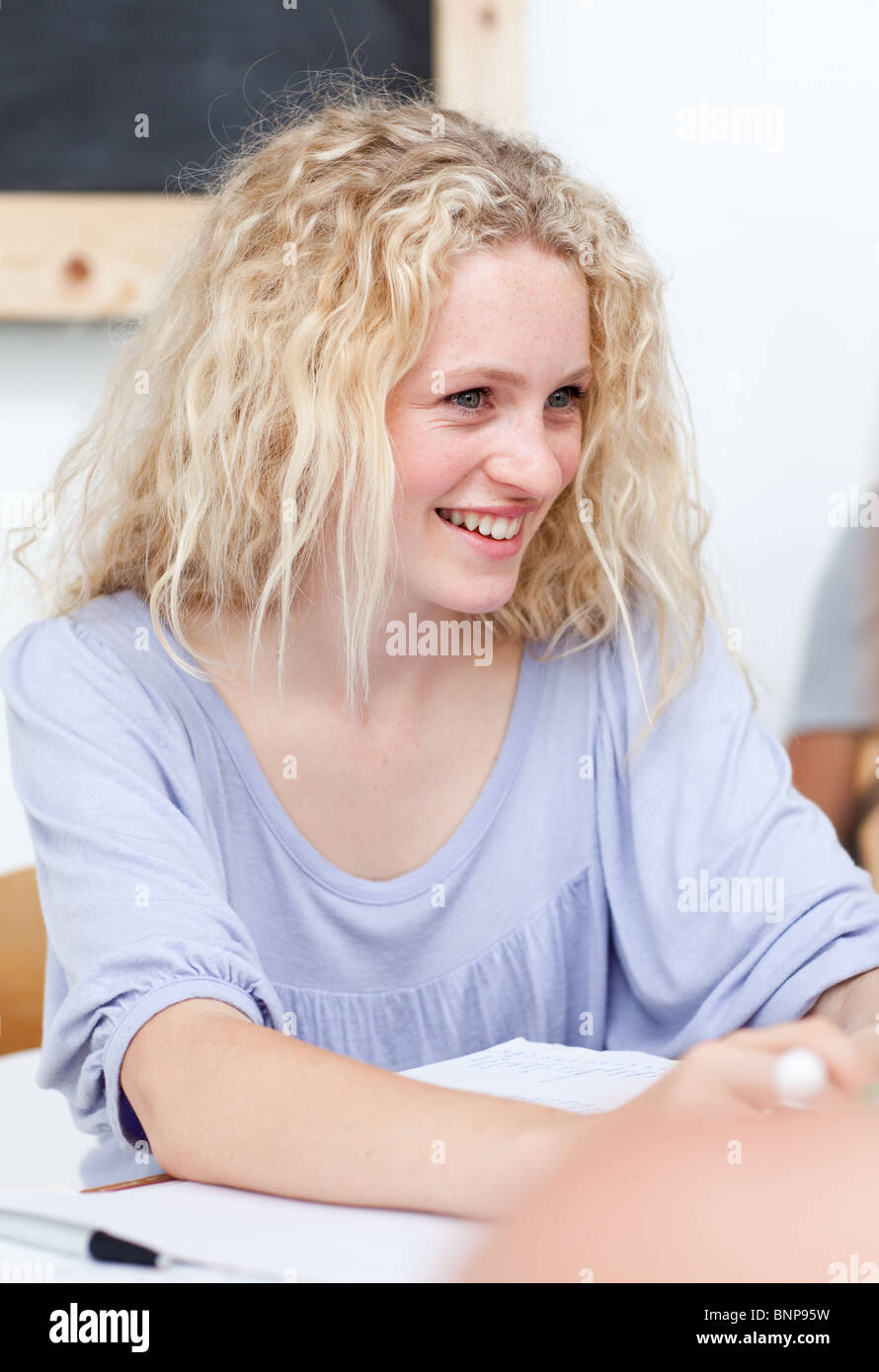 Blonde teenager doing homework in hi-res stock photography and images ...