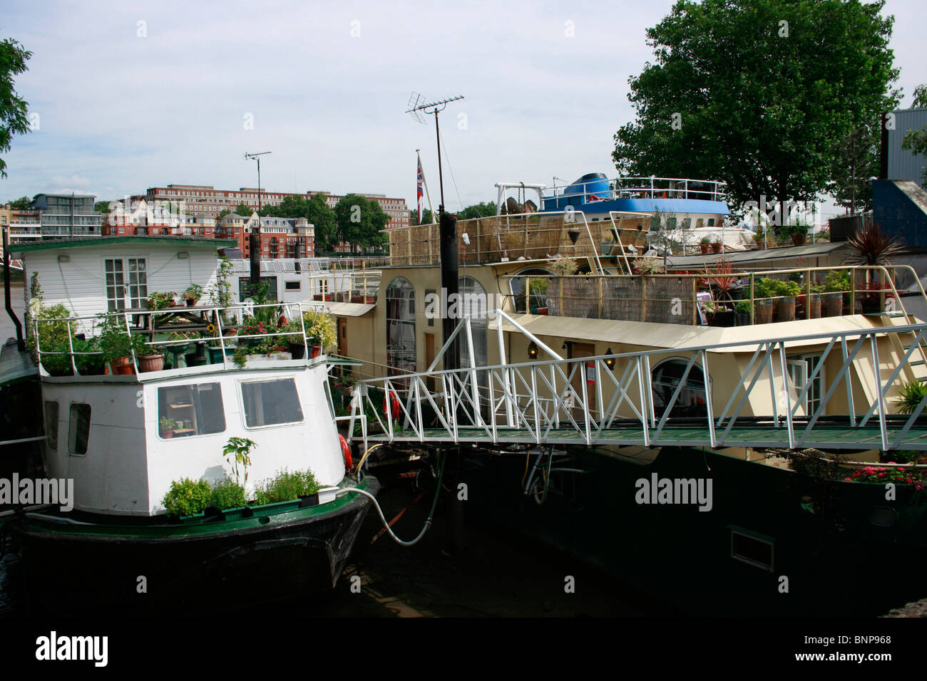 Boats and barges in Tideway Village, London Stock Photo - Alamy