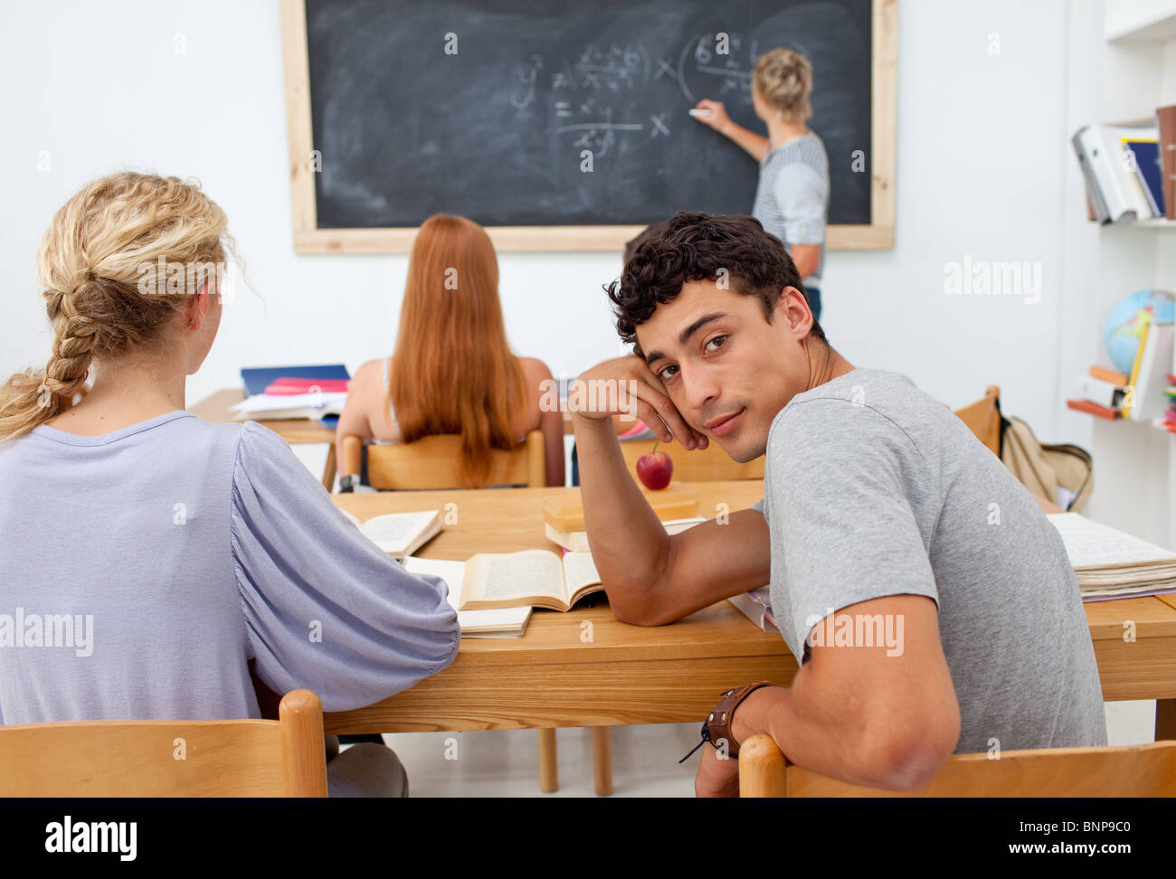Teenagers studying together in a class Stock Photo - Alamy