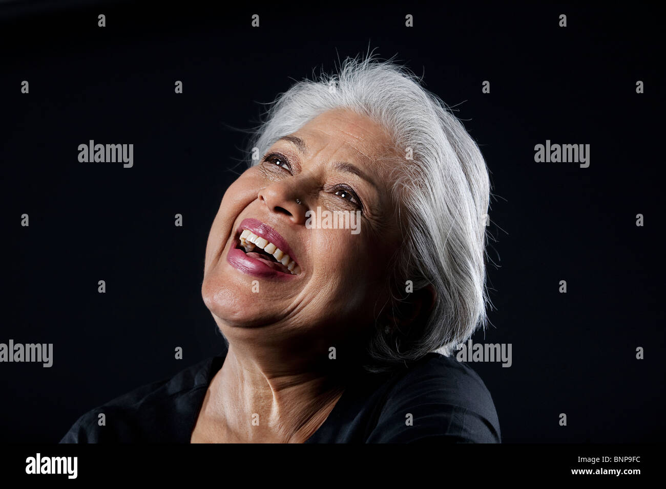 Old woman laughing Stock Photo - Alamy