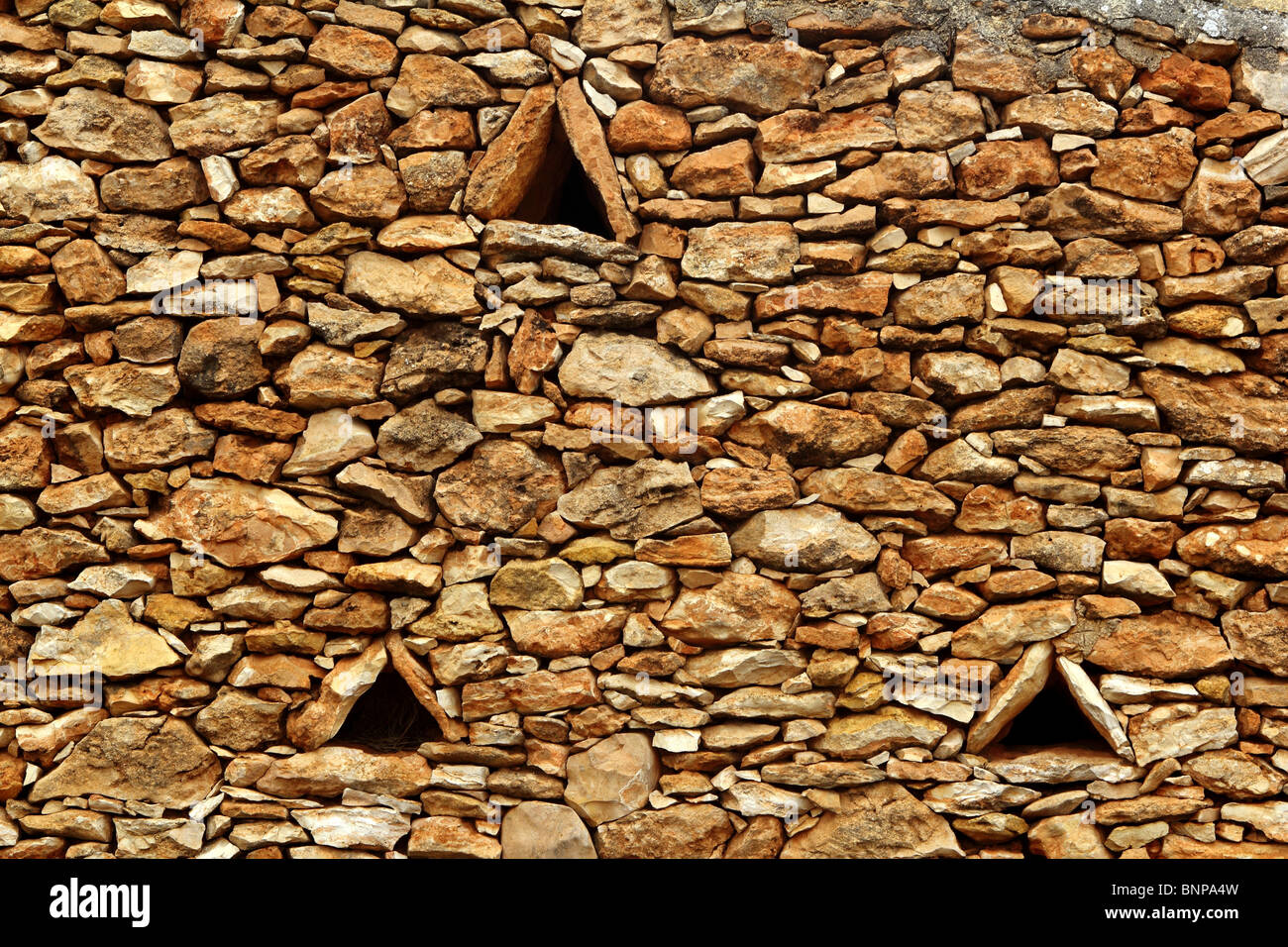 Masonry stone wall triangle windows hi-res stock photography and images ...
