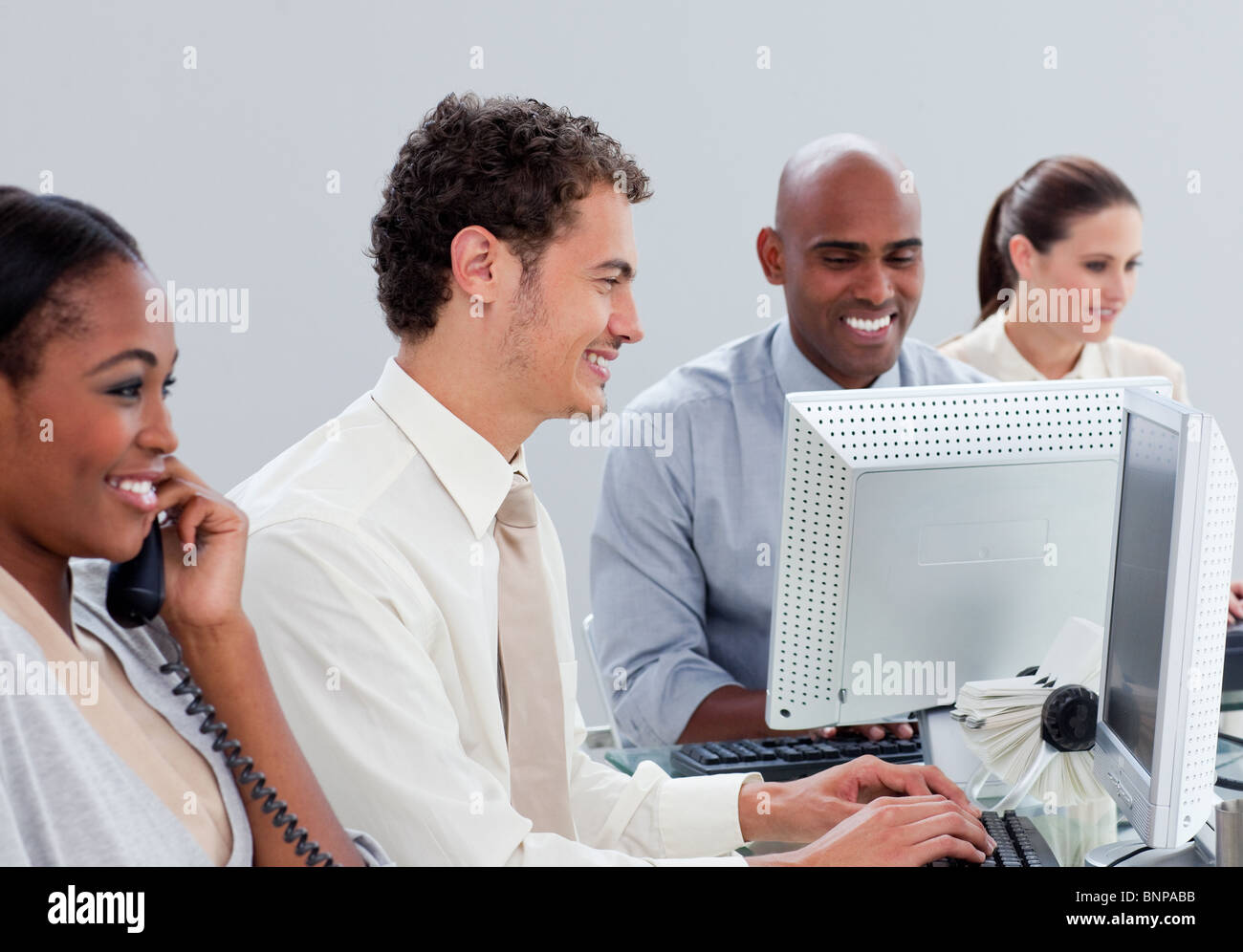 Fortunate business group working hard in the office Stock Photo - Alamy