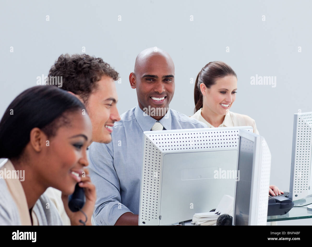 Lucky business group working hard in the office Stock Photo - Alamy