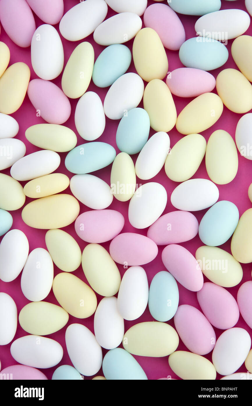 sugared almond sweet candy pastel colorful on soft pink Stock Photo - Alamy