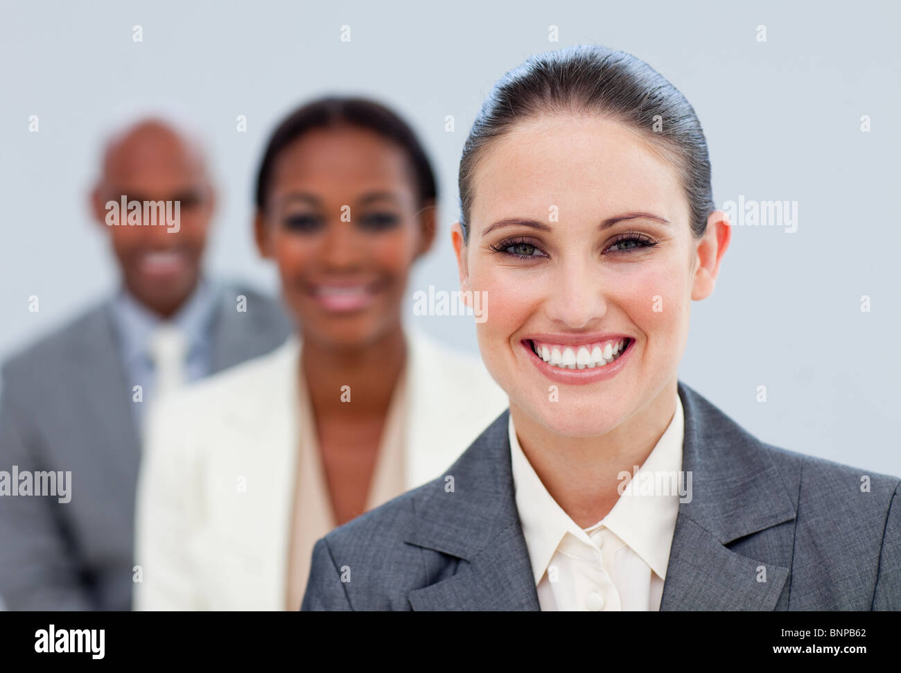 Close-up of an attractive manager and her team Stock Photo - Alamy