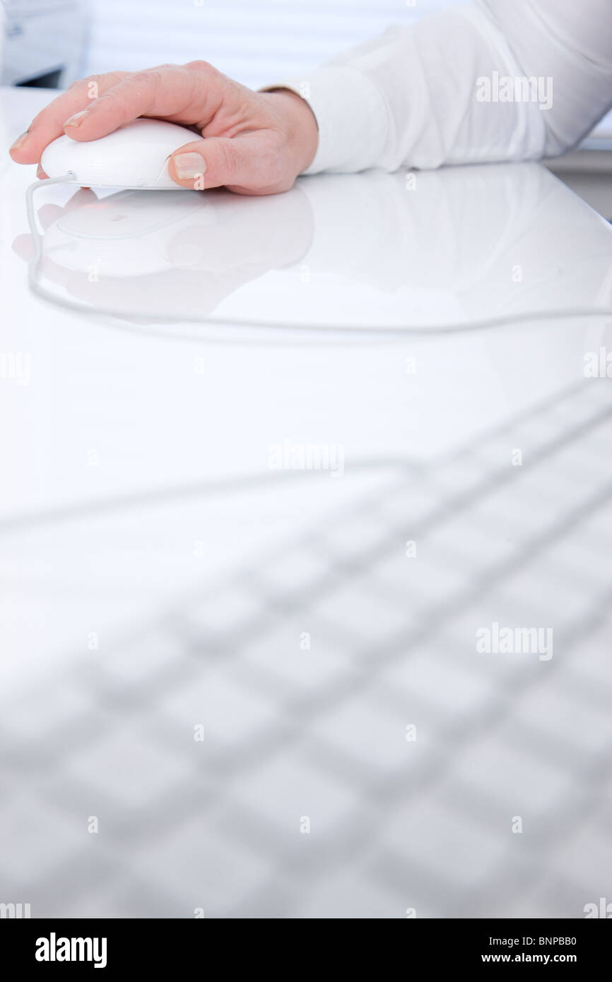 Close up of a woman's hand on a computer mouse Stock Photo - Alamy