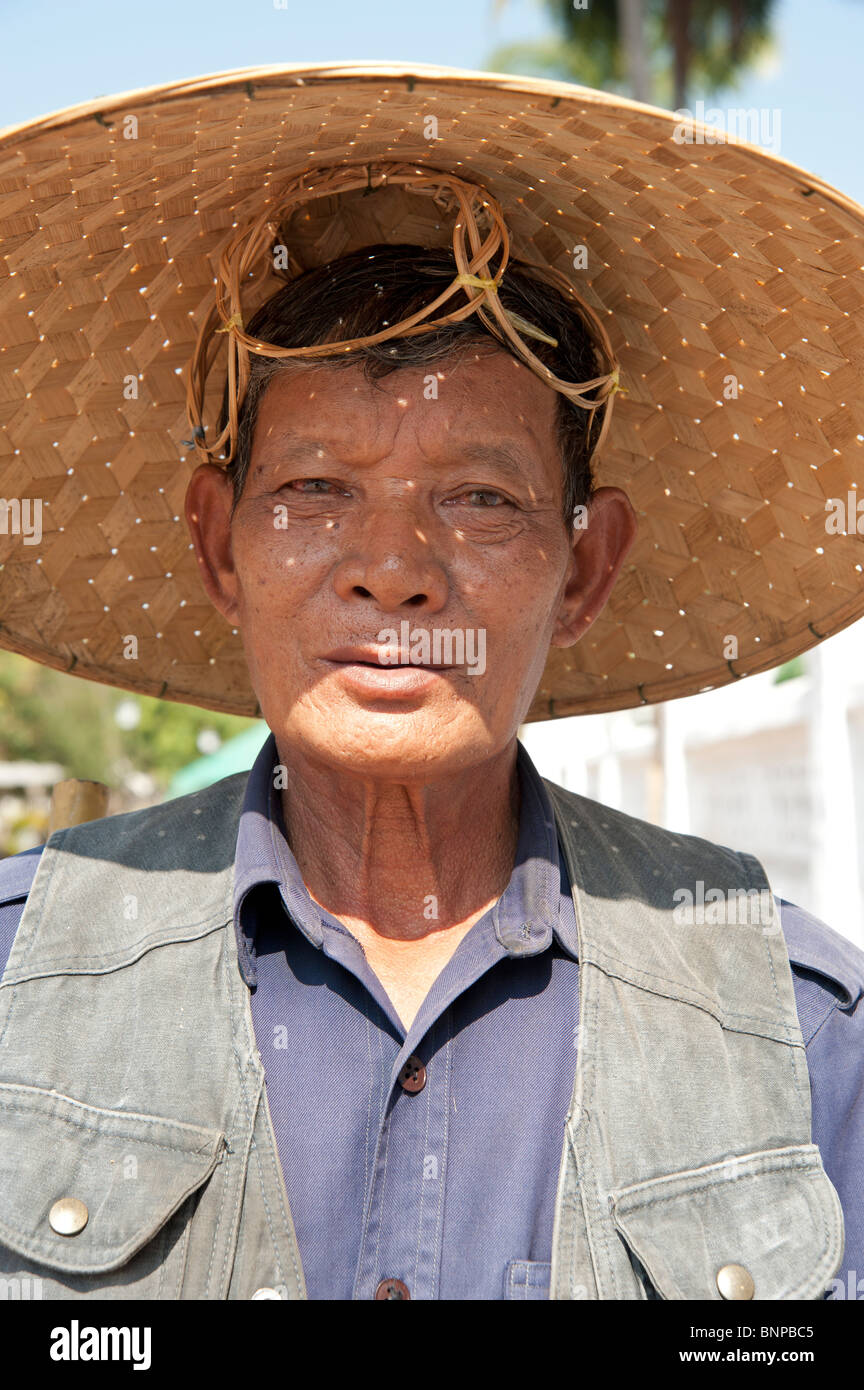 Lao man wearing straw hat in Luang Prabang Laos Stock Photo - Alamy