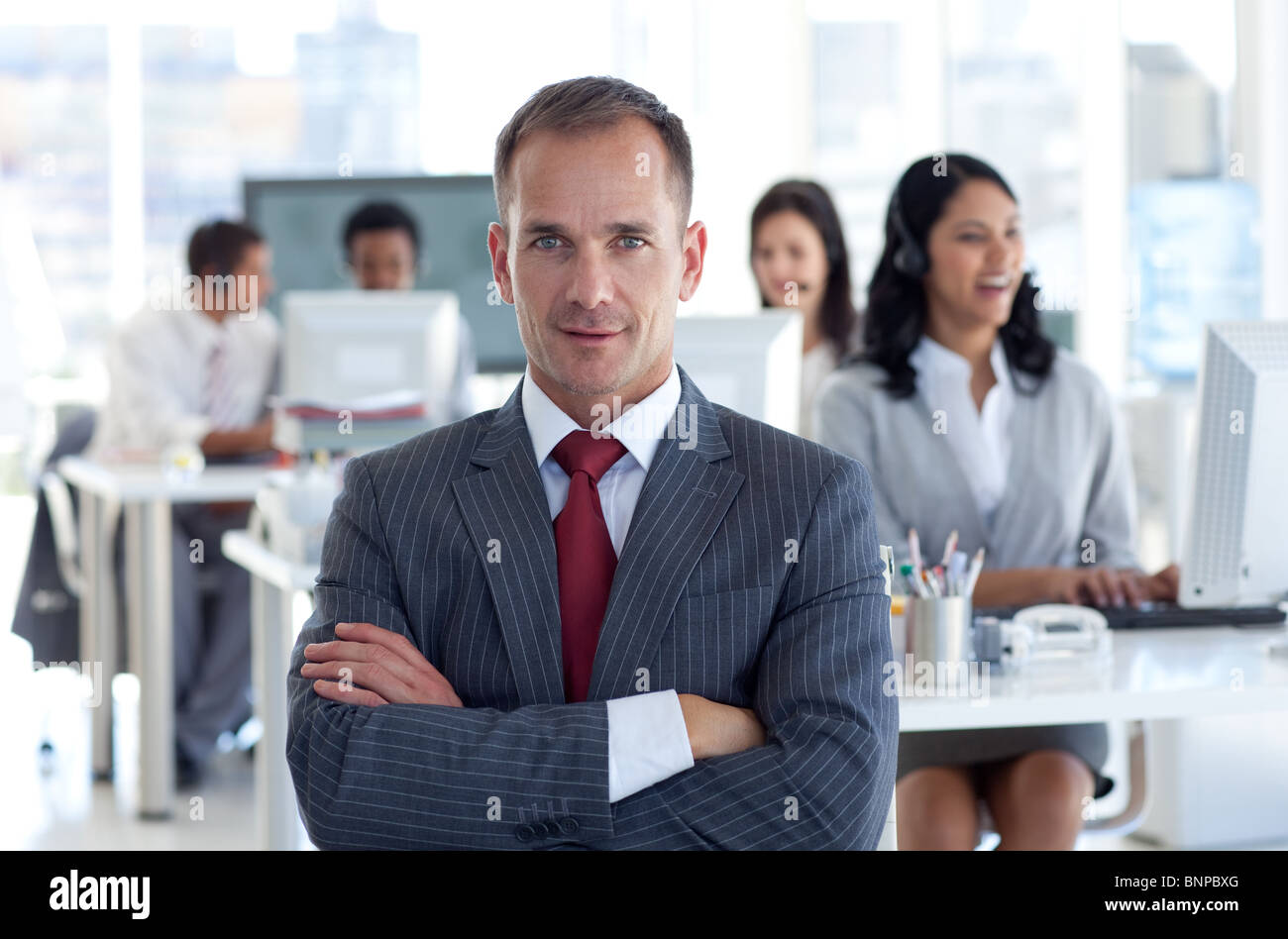 Confident manager leading his team in a call center Stock Photo - Alamy
