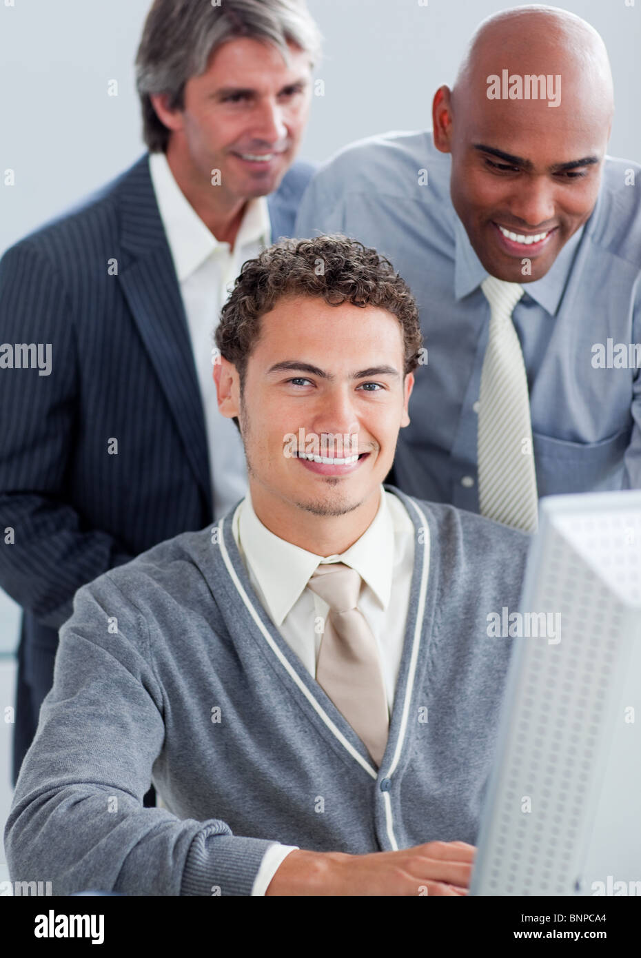 Handsome businessmen working at a computer Stock Photo - Alamy