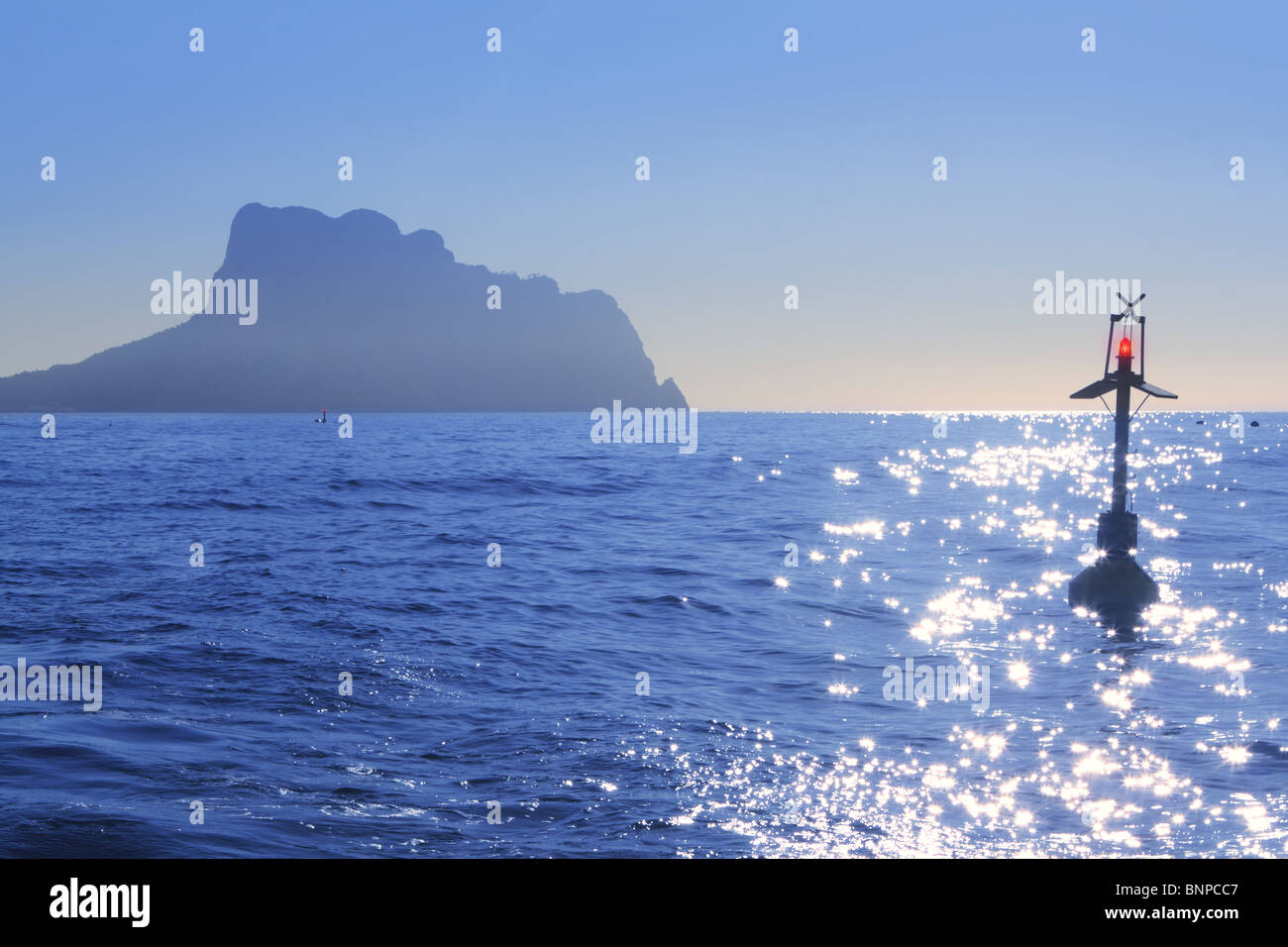 Ifach Penon mountain from Calpe fog backlight floating beacon Stock ...