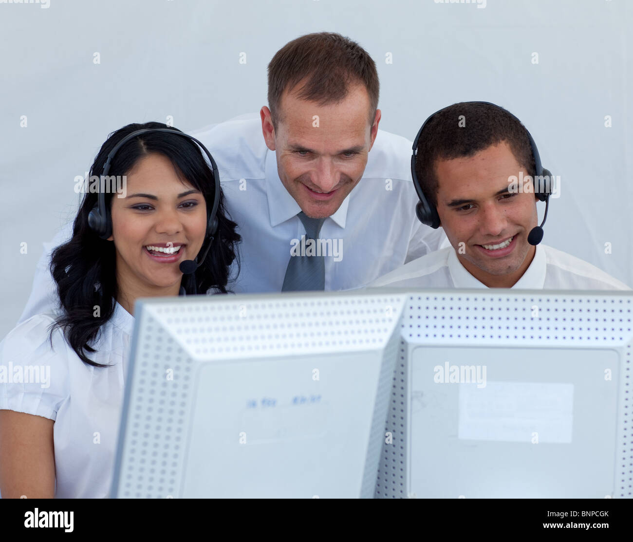 Business team working in a call canter Stock Photo - Alamy