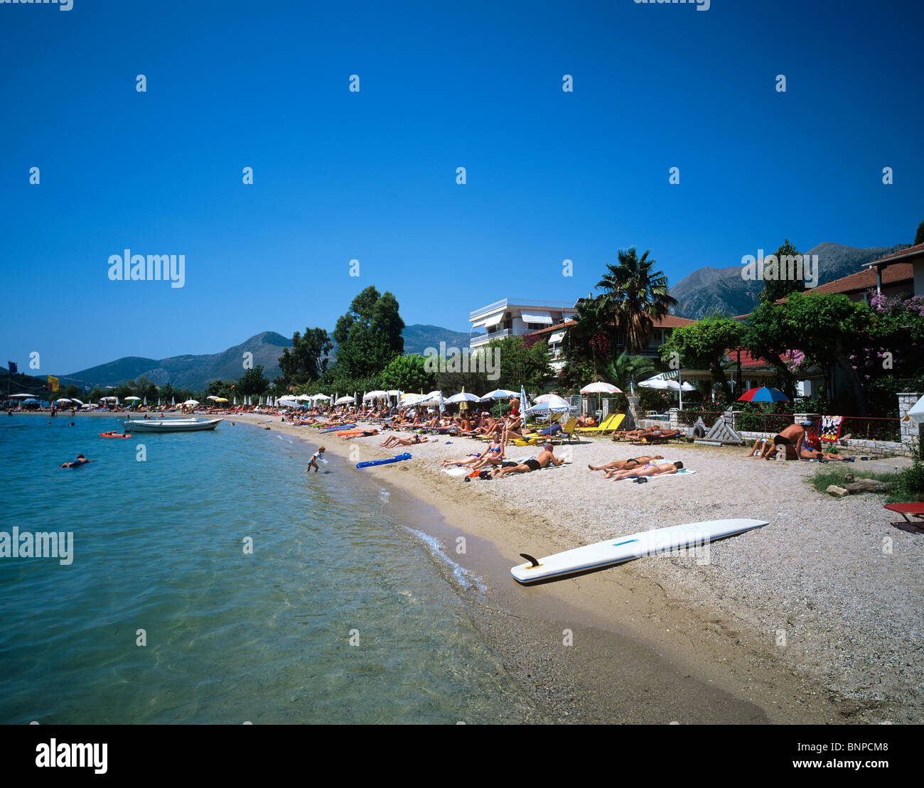 Beach scene at the picturesque resort of Nidri on the Greek island of ...