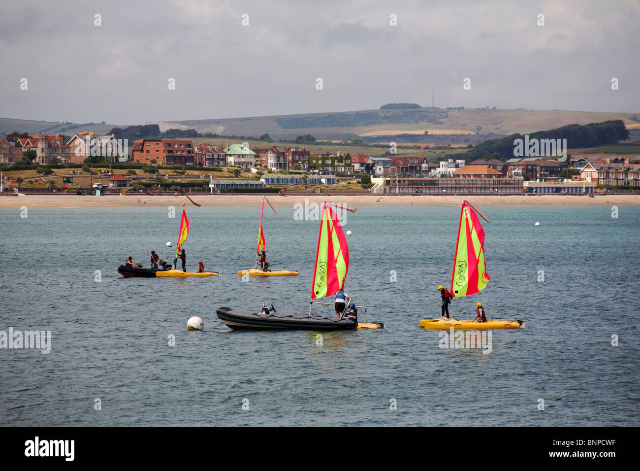 Having fun in the Fun Boats at Weymouth seaside Stock Photo - Alamy