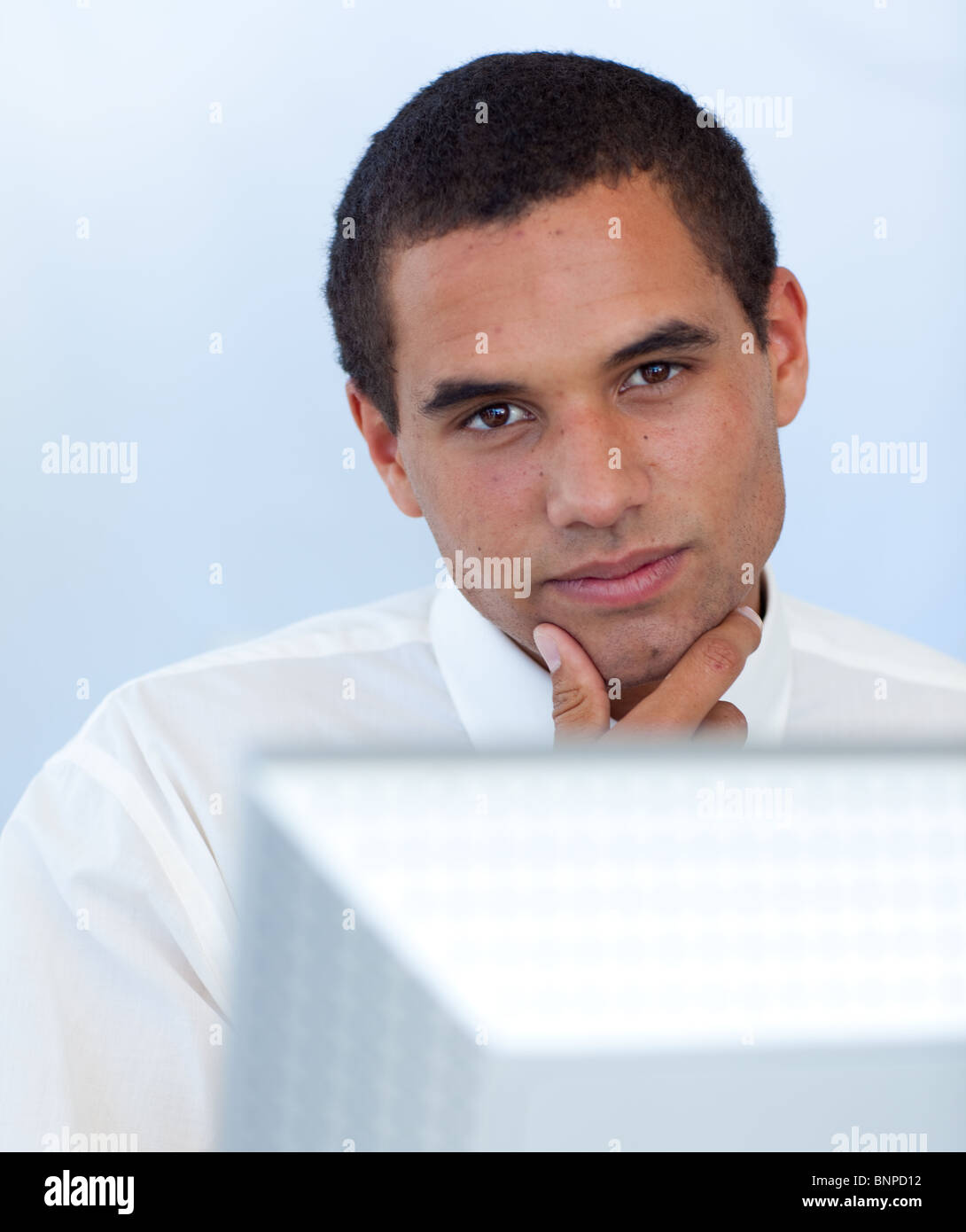 Attractive businessman working with a computer Stock Photo - Alamy