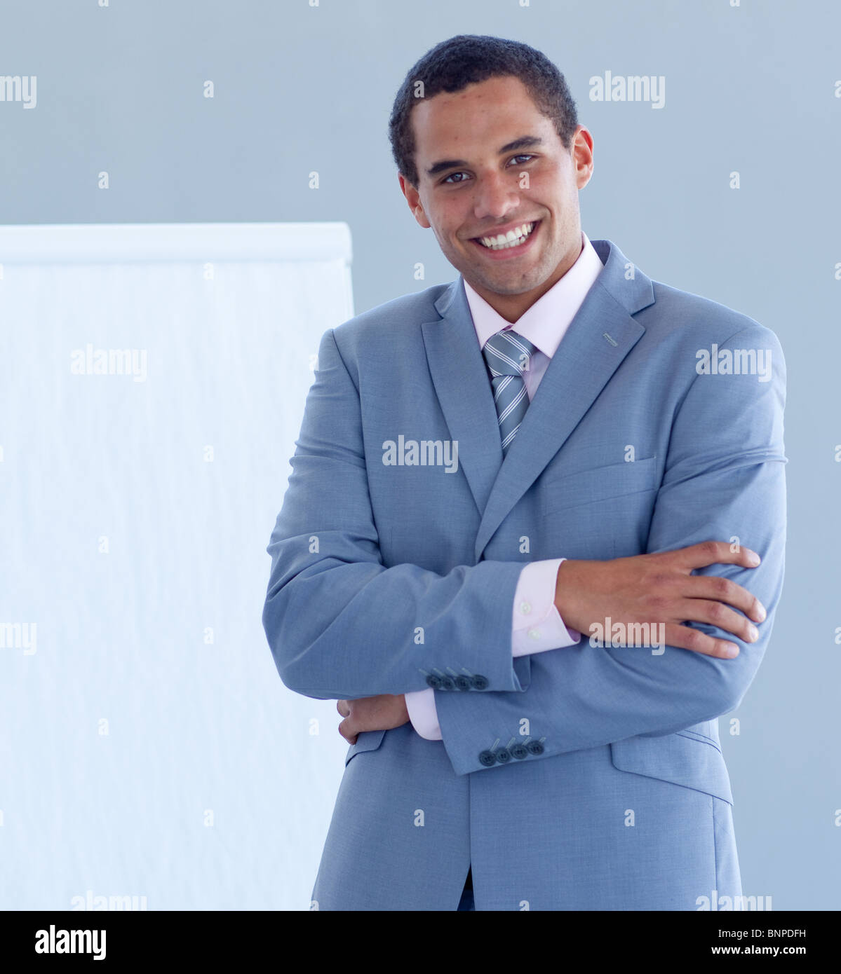 Smiling businessman giving a presentation Stock Photo - Alamy