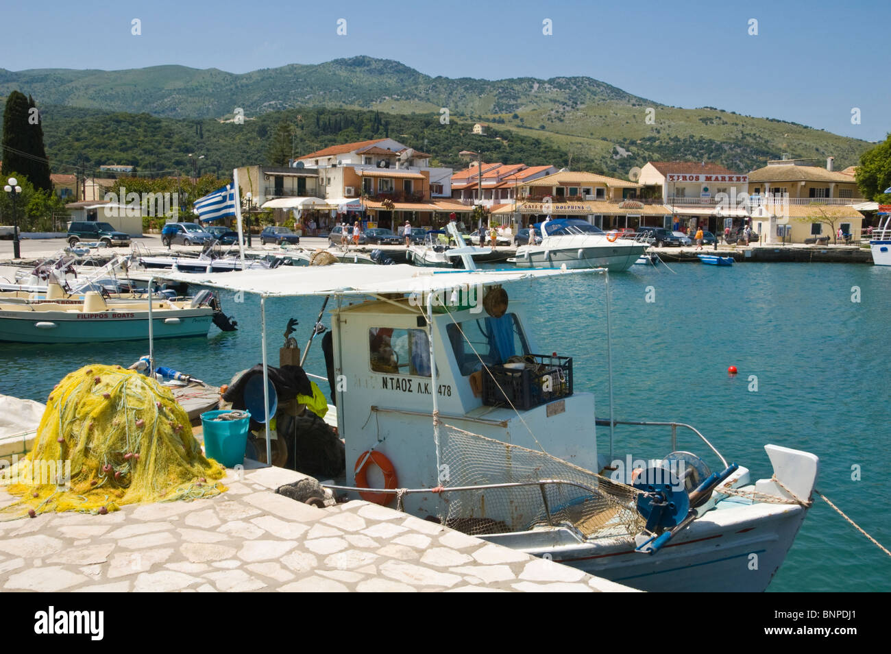 Local inshore fishing boats moored in harbour at Kassiopi on the Greek ...