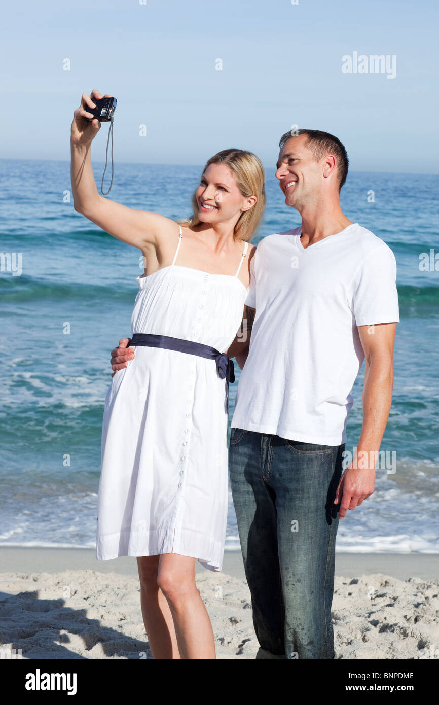 Enamored couple taking a photography Stock Photo - Alamy