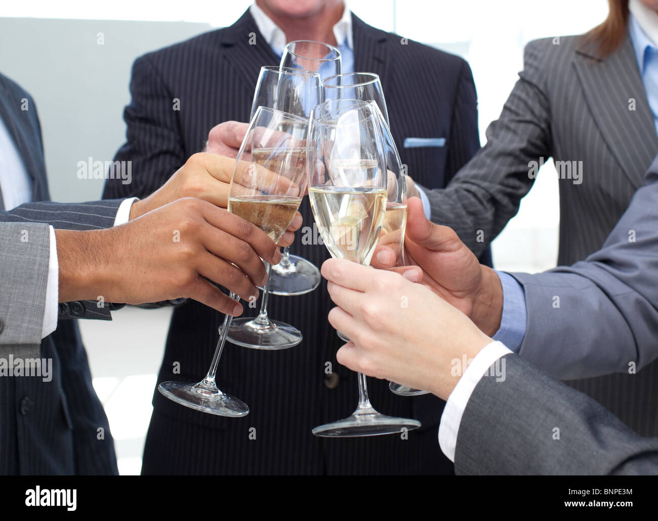Team diverse happy colleagues toasting hi-res stock photography and ...