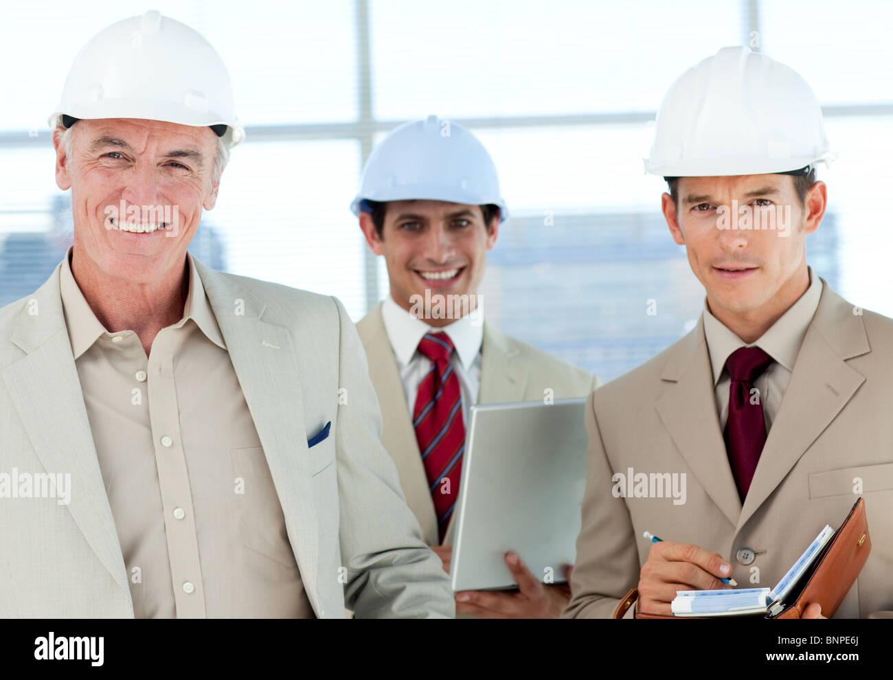 A group of architect smiling at the camera Stock Photo - Alamy