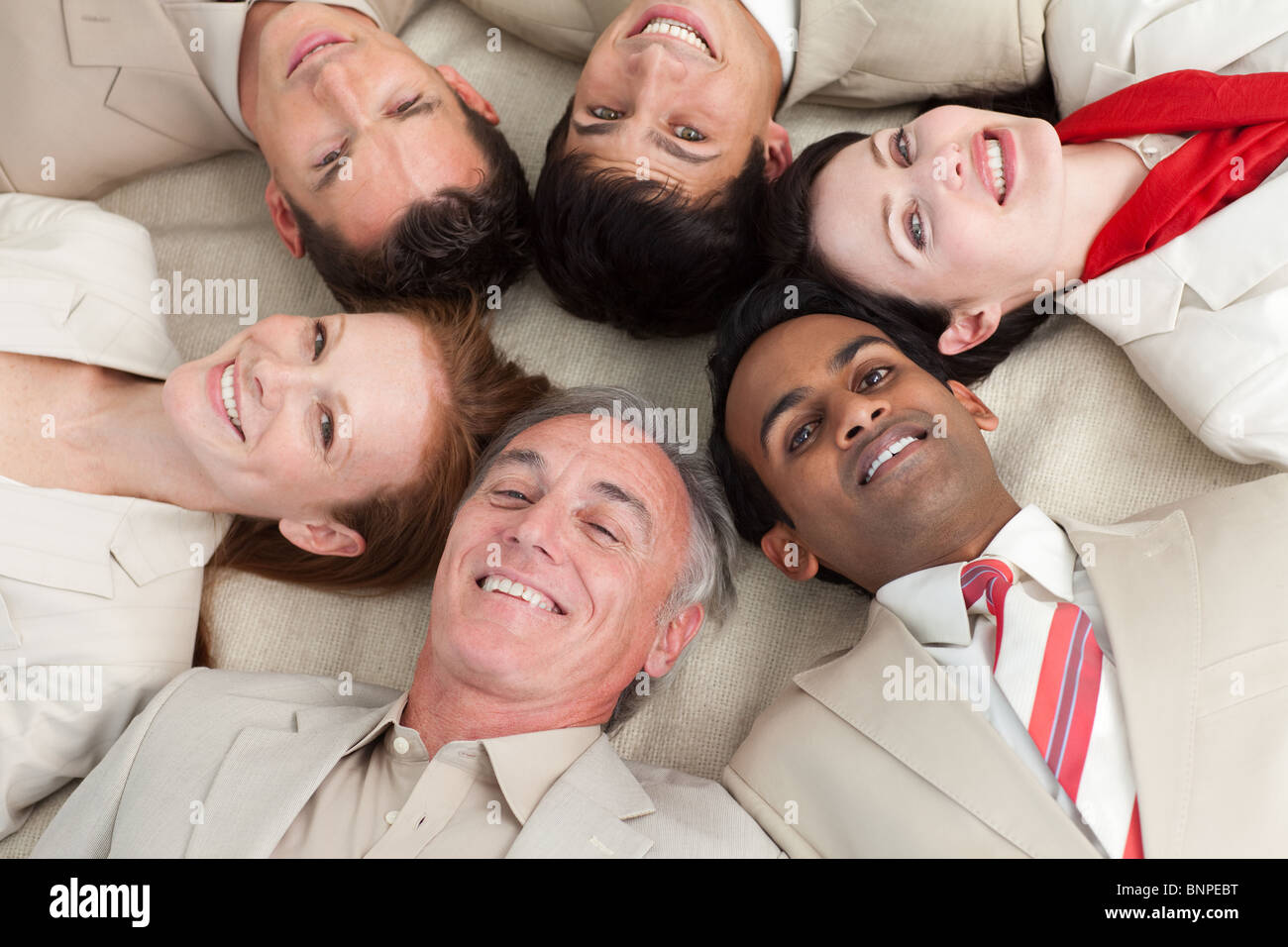 Heads together white background hi-res stock photography and images - Alamy