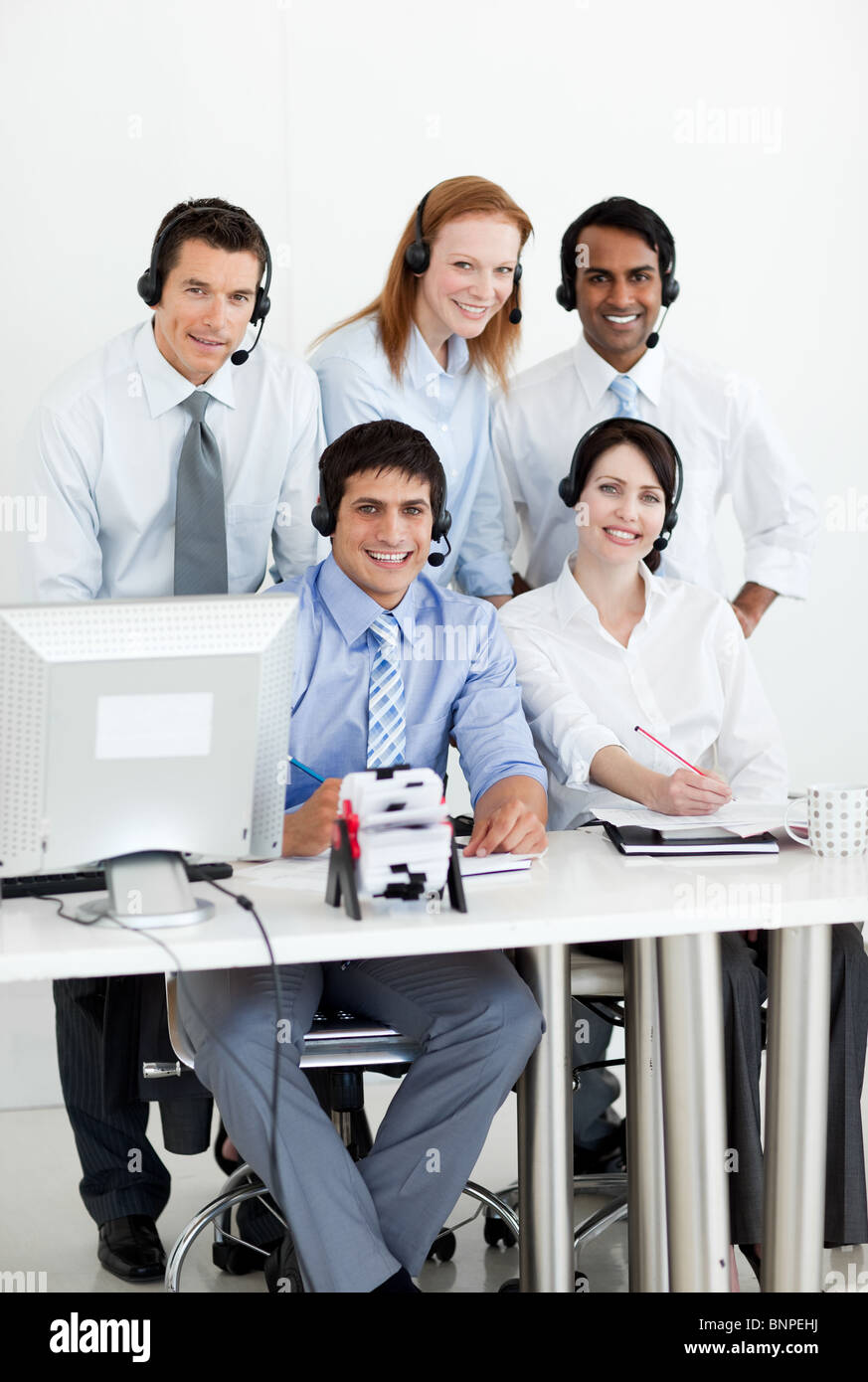 Portrait of a business team with headset on Stock Photo - Alamy