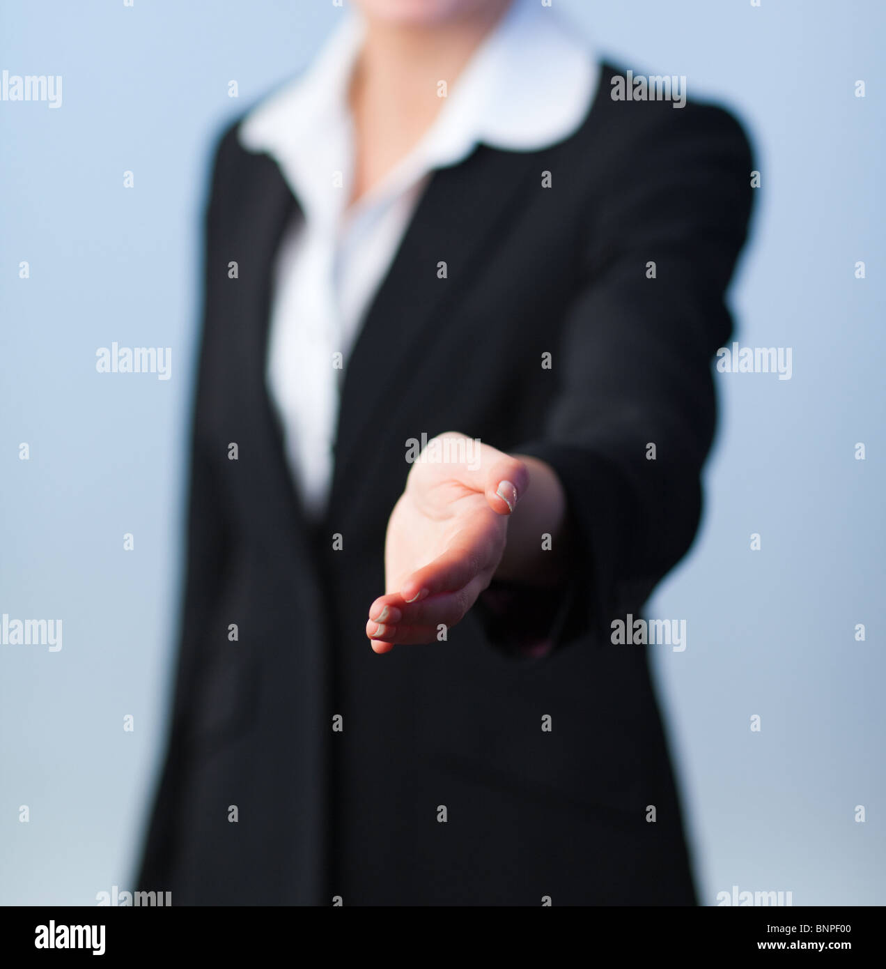 Woman offering a handshake Stock Photo - Alamy