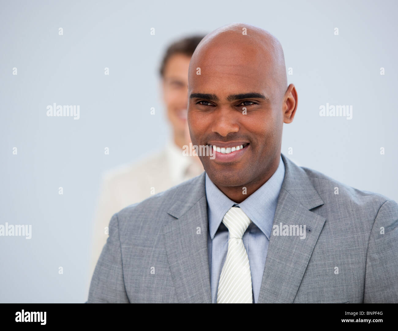 Portrait of a male executive and his colleague Stock Photo - Alamy