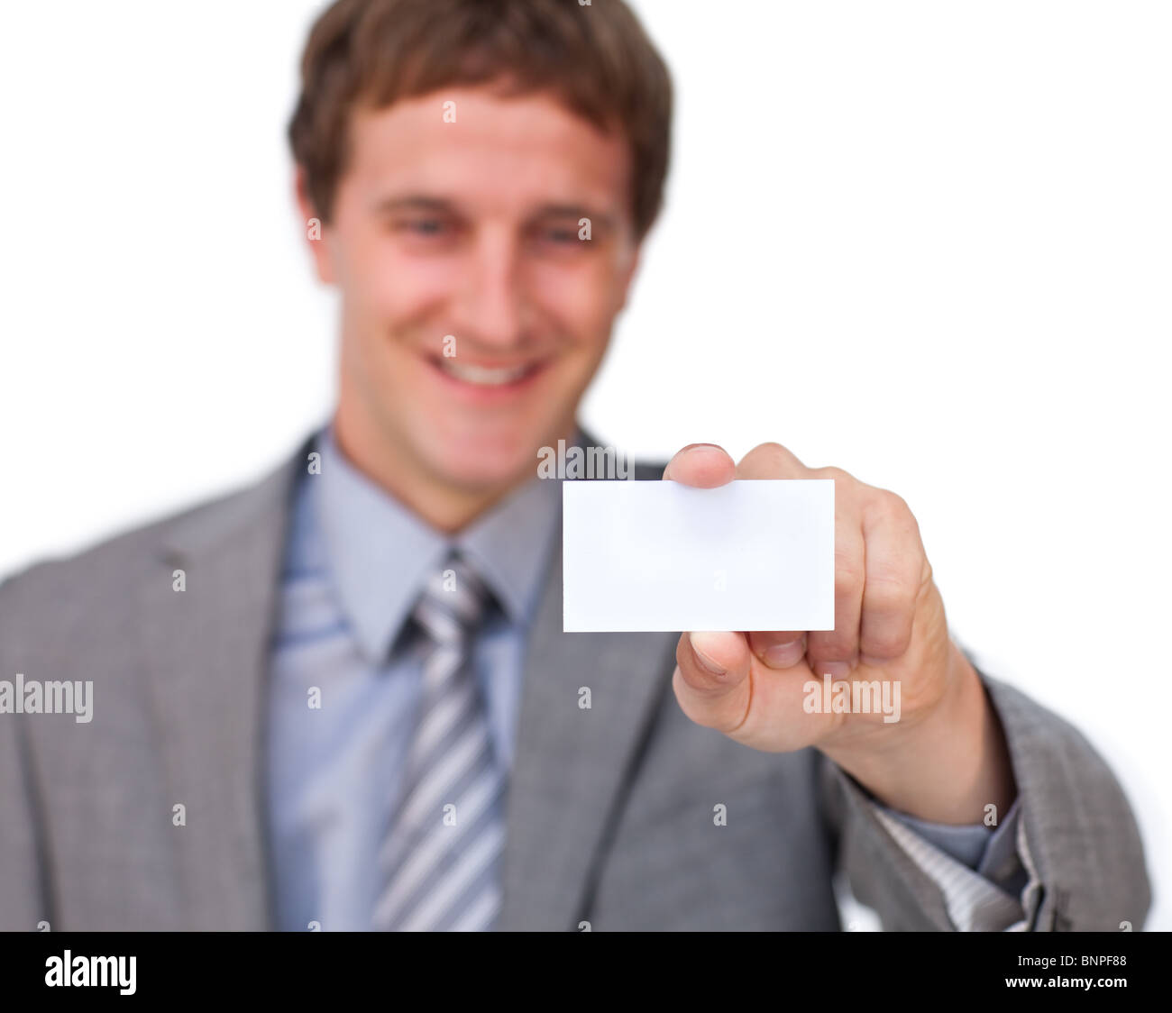 Attractive Businessman showing a business card Stock Photo - Alamy