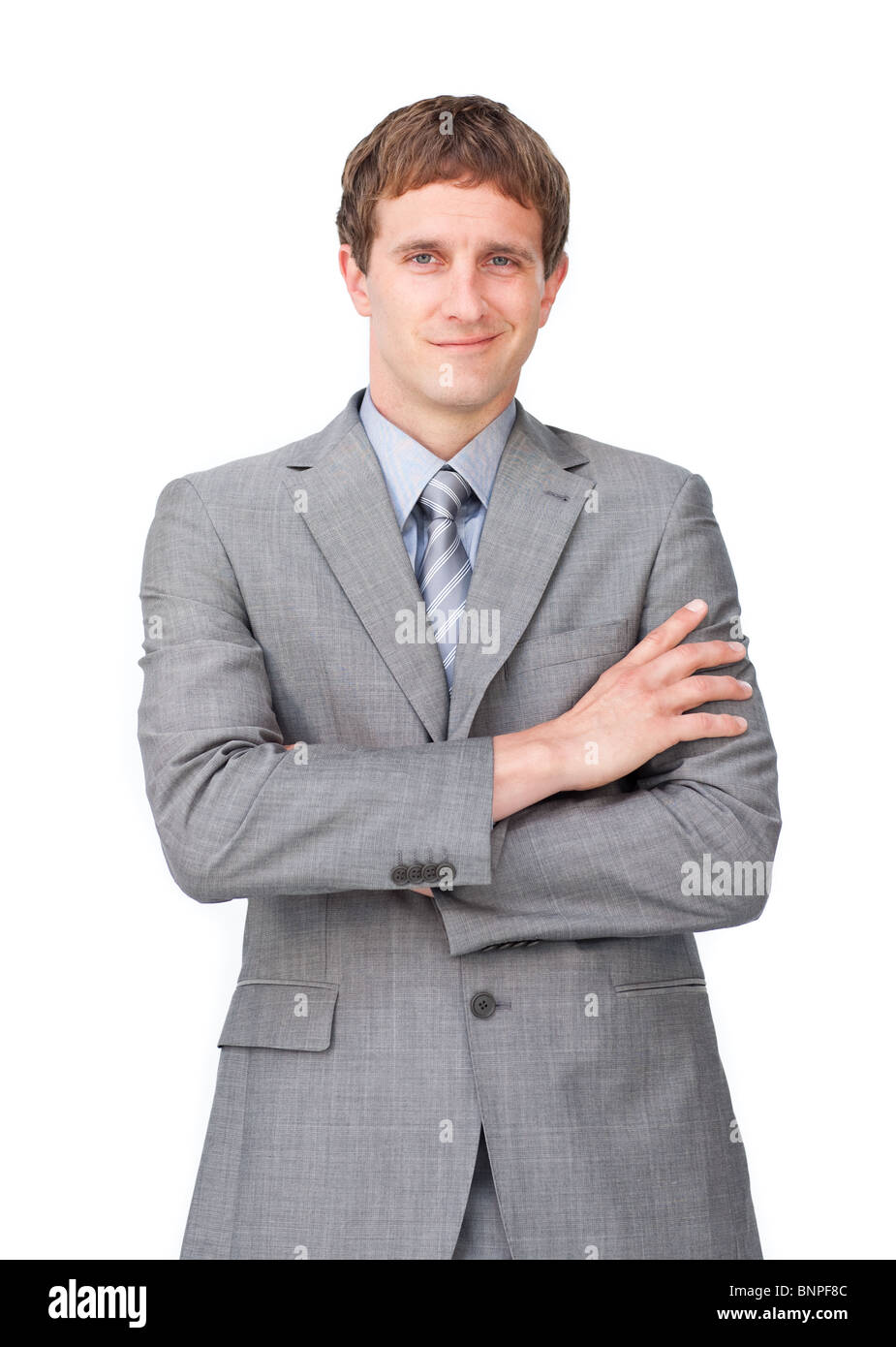 Confident businessman with folded arms Stock Photo - Alamy