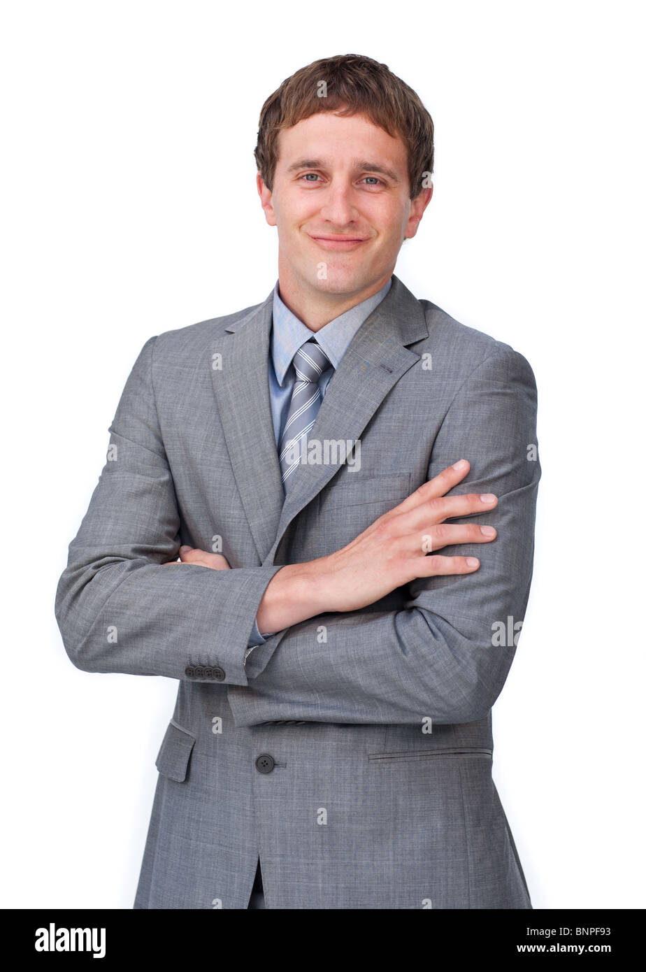 Young businessman with folded arms Stock Photo - Alamy
