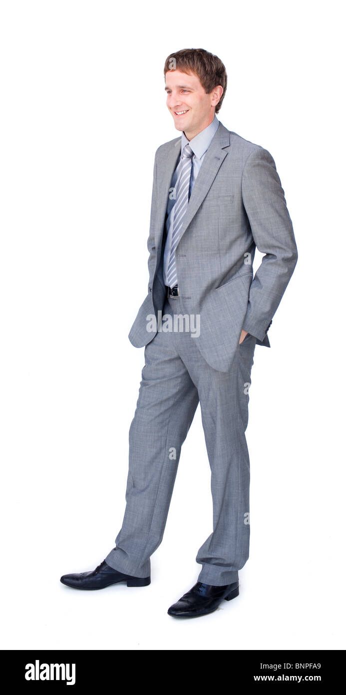 Smiling young businessman with hands in pockets Stock Photo - Alamy