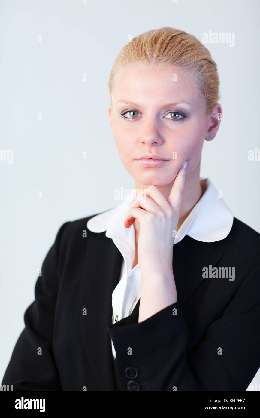 Serious business woman looking at the camera Stock Photo - Alamy