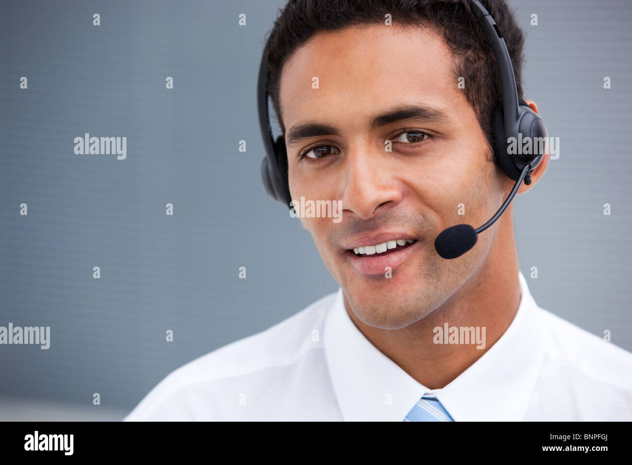 Portrait of a handsome customer service agent at work Stock Photo - Alamy