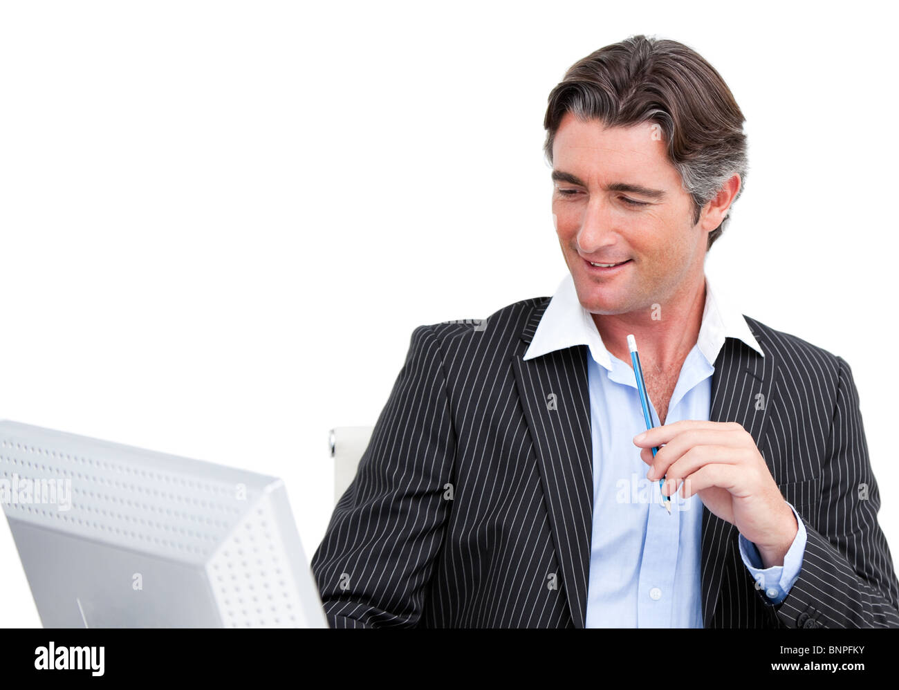 Handsome businessman working at a computer Stock Photo - Alamy
