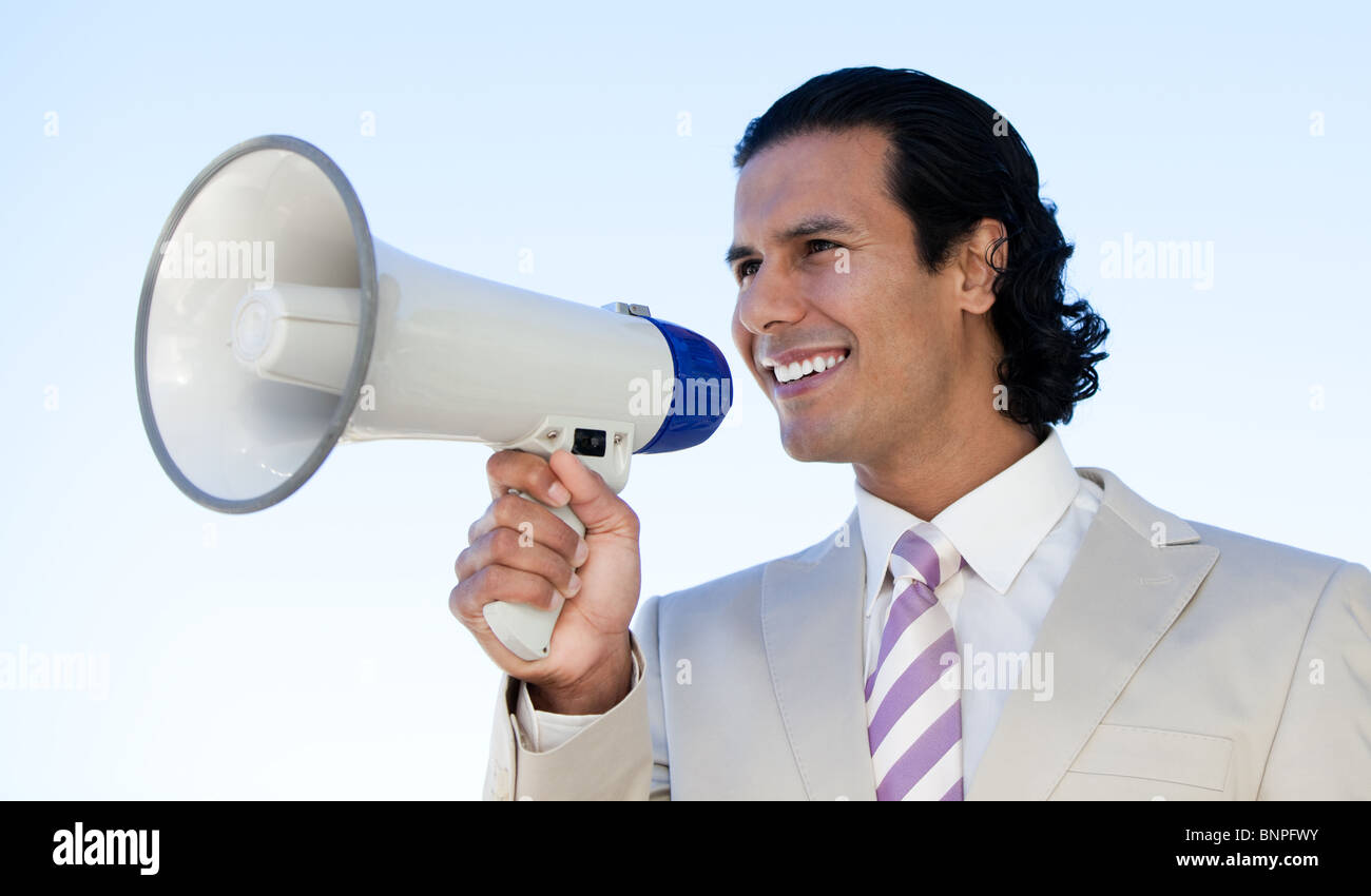 Portrait of a latin business man shouting through a megaphone Stock ...