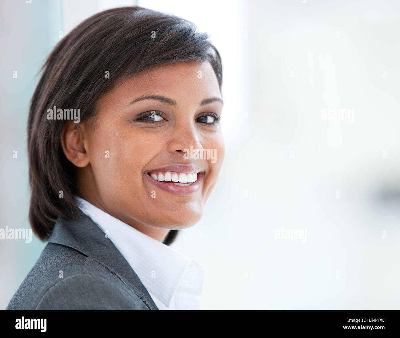 Portrait of a smiling business woman at work Stock Photo - Alamy