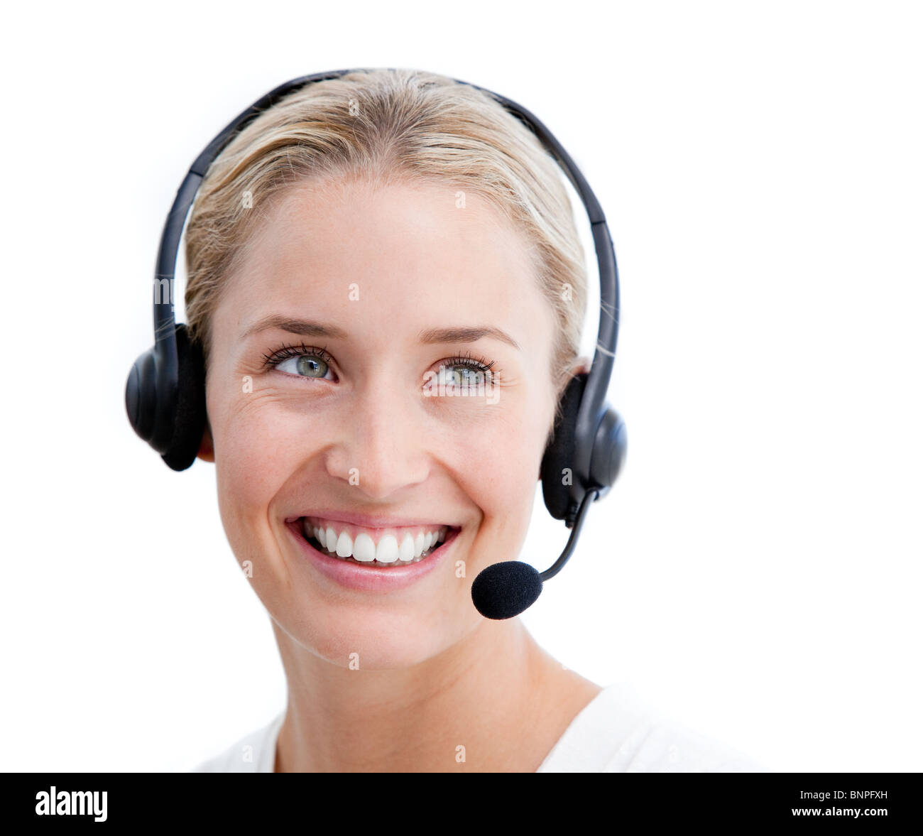 Smiling customer service representative using headset Stock Photo - Alamy