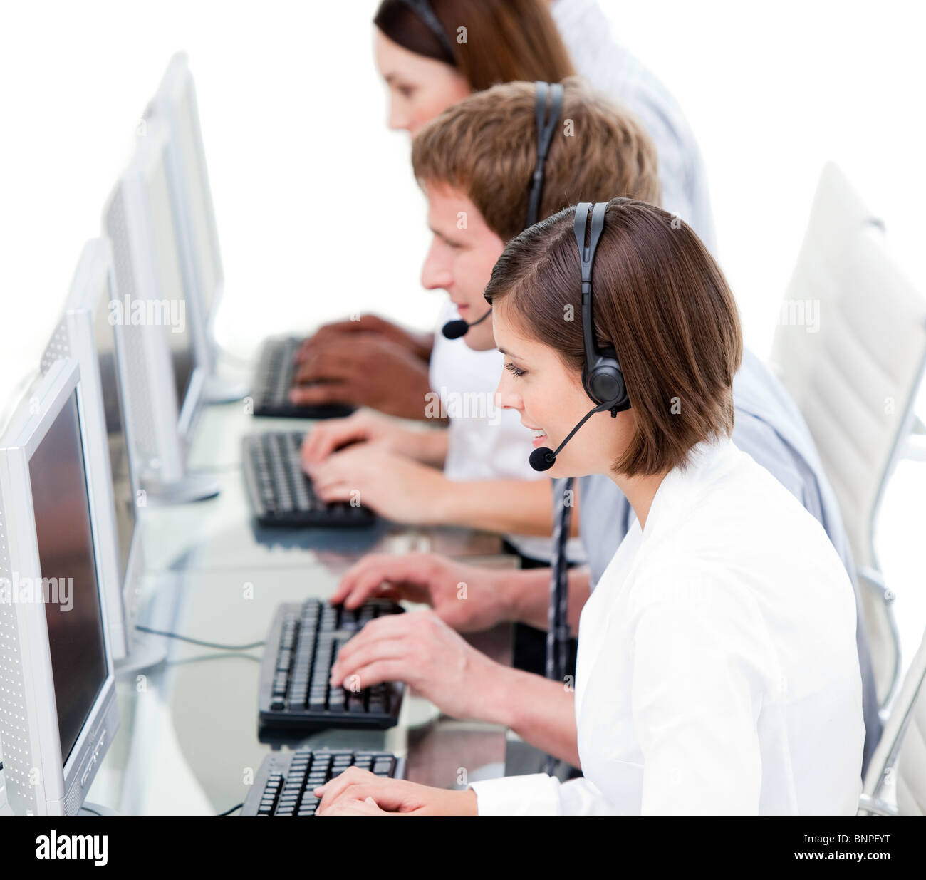 Serious business team working in a call center Stock Photo - Alamy
