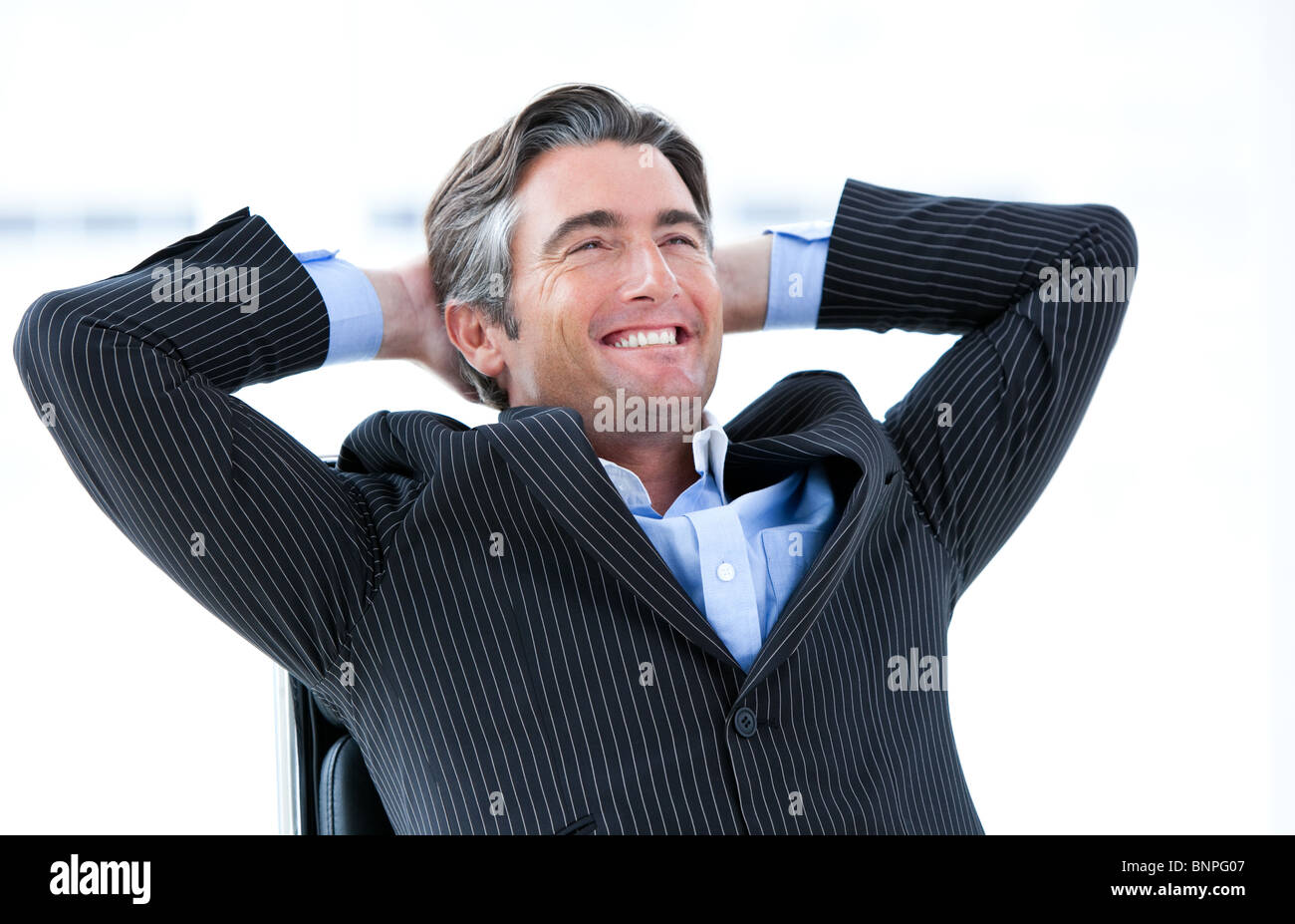 Laughing male executive thinking hi-res stock photography and images ...