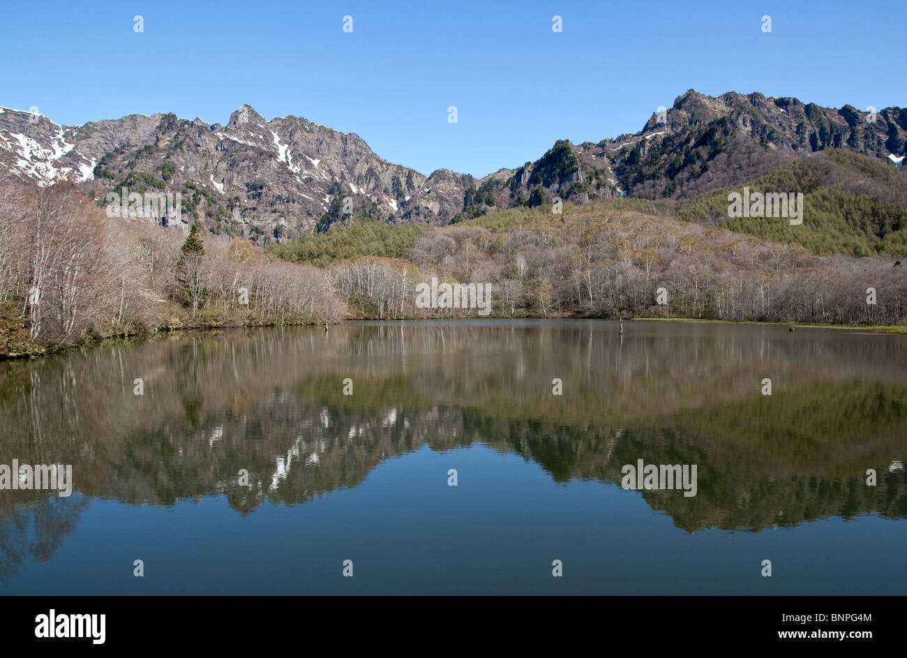 Kagami Ike (Mirror Lake), in Spring with Togakushi mountain in the ...