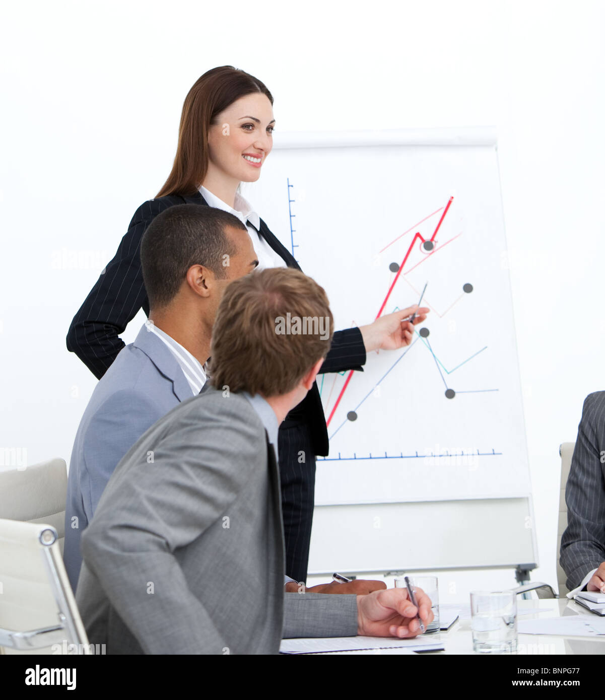 Businesswoman doing presentation coworkers hi-res stock photography and ...