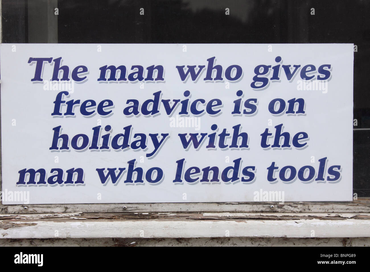 Funny mechanic's sign in workshop window Stock Photo - Alamy