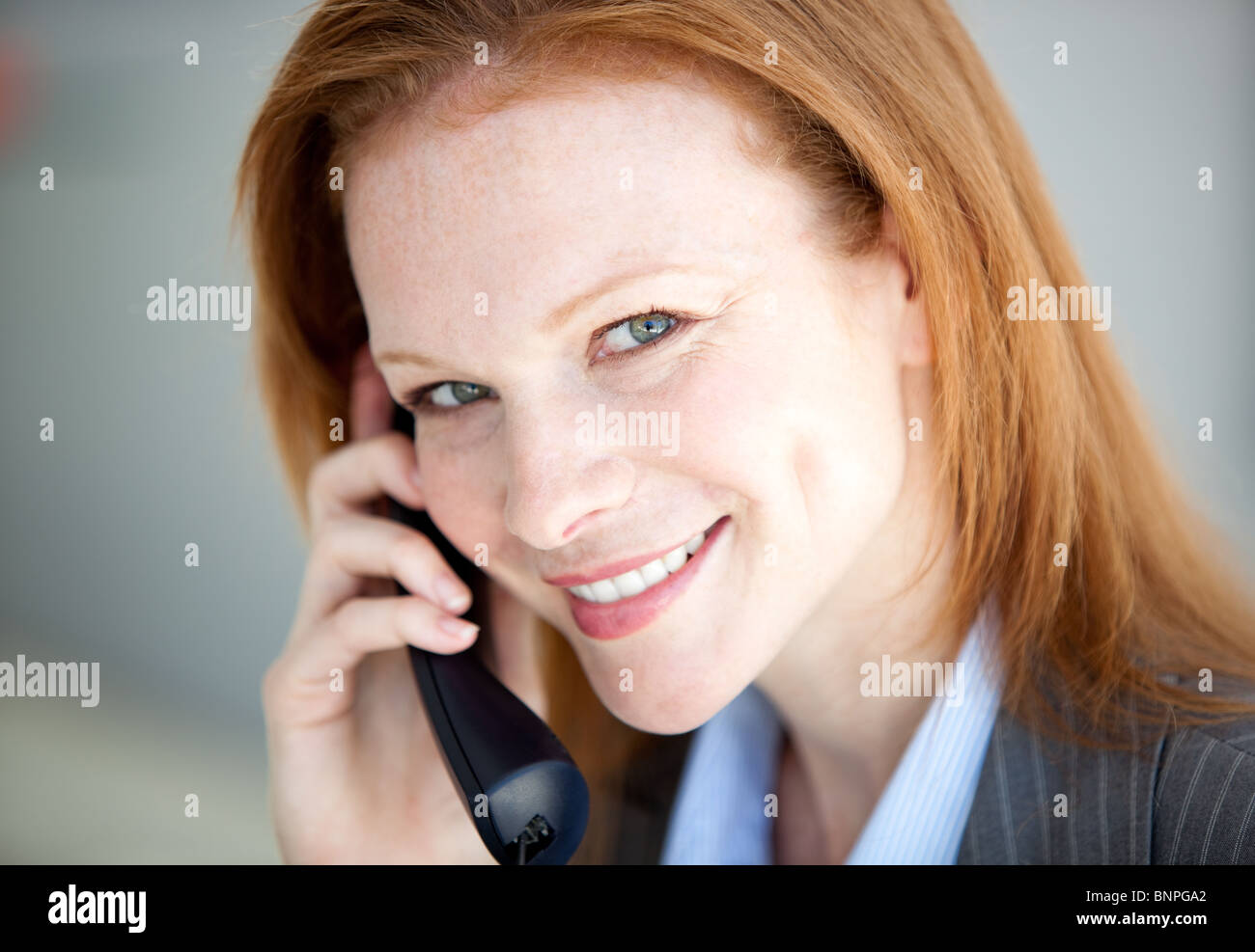 Self-assured business woman taking a call Stock Photo - Alamy