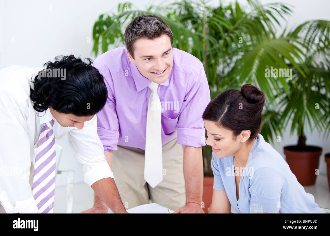 Confident business people interacting Stock Photo - Alamy